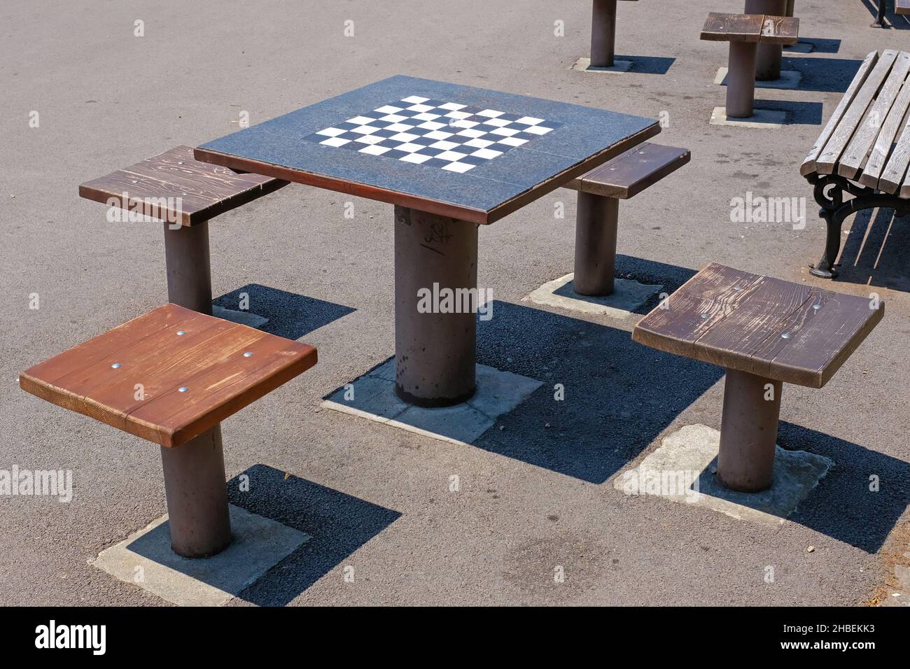 Marble stone chess board table and chairs fixture in park Stock Photo ...