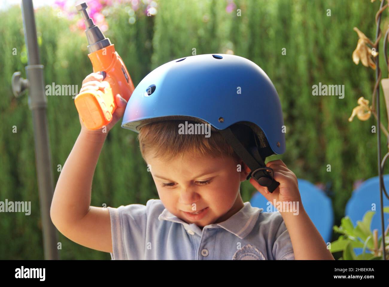 Child looking angry at toy hi-res stock photography and images - Alamy