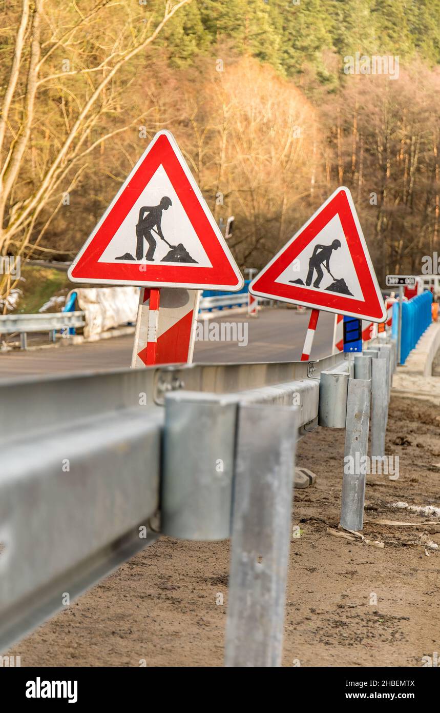 Road sign work on the road. Finishing work on the construction of a ...