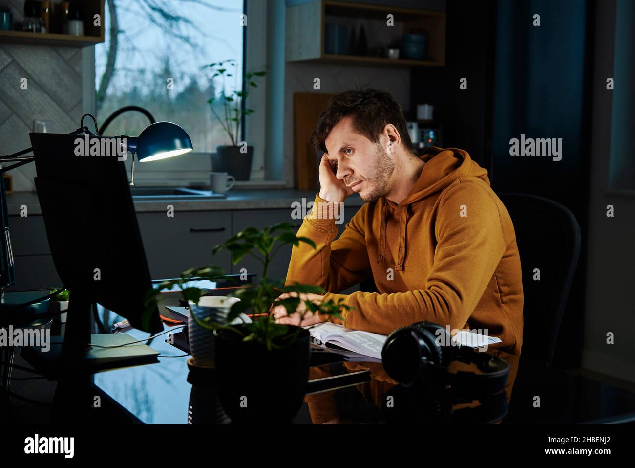 Man works late at home workplace, remote work concept. Burnout and ...
