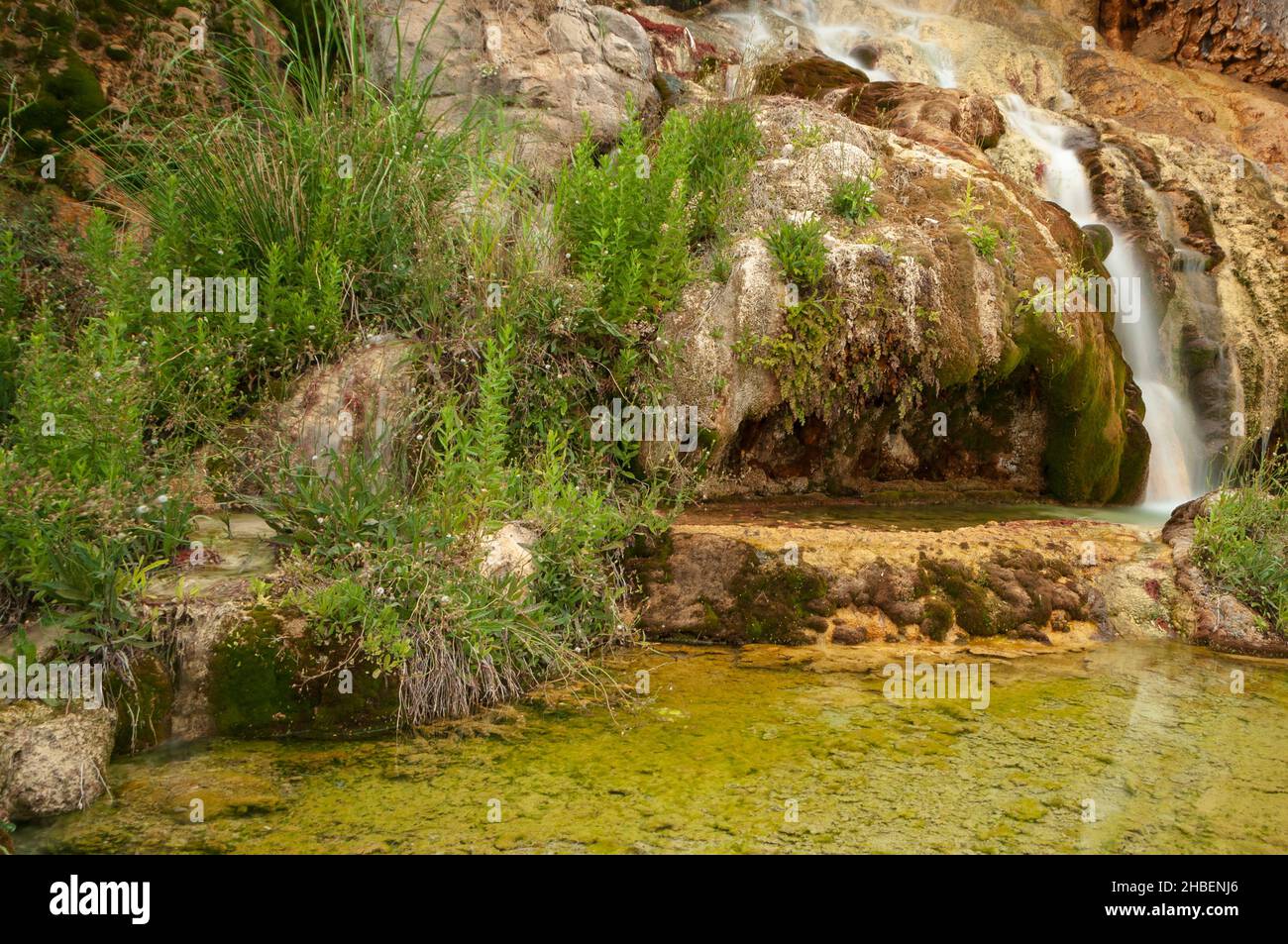 Thermal water cascade in the natural aqueduct of Villanueva Stock Photo ...