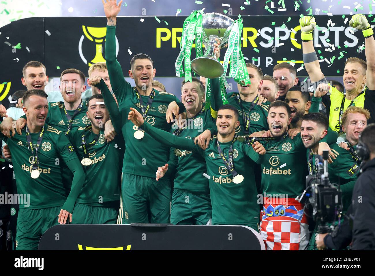 Celtic players celebrate with the trophy after winning the Premier ...