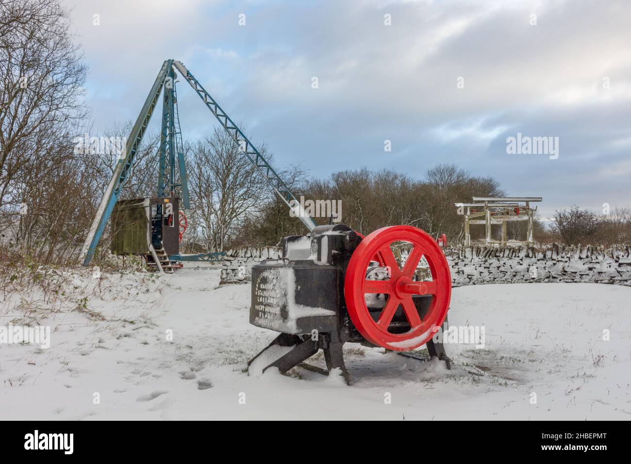 Historic mining equipment in snow at Tegg's Nose Country Park ...