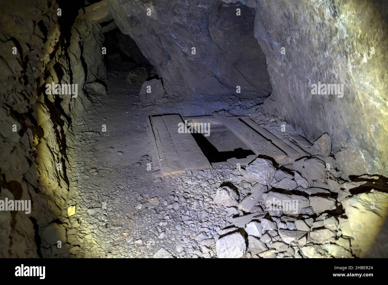 Boarded over structures protect mine shaft going straight down into the ...