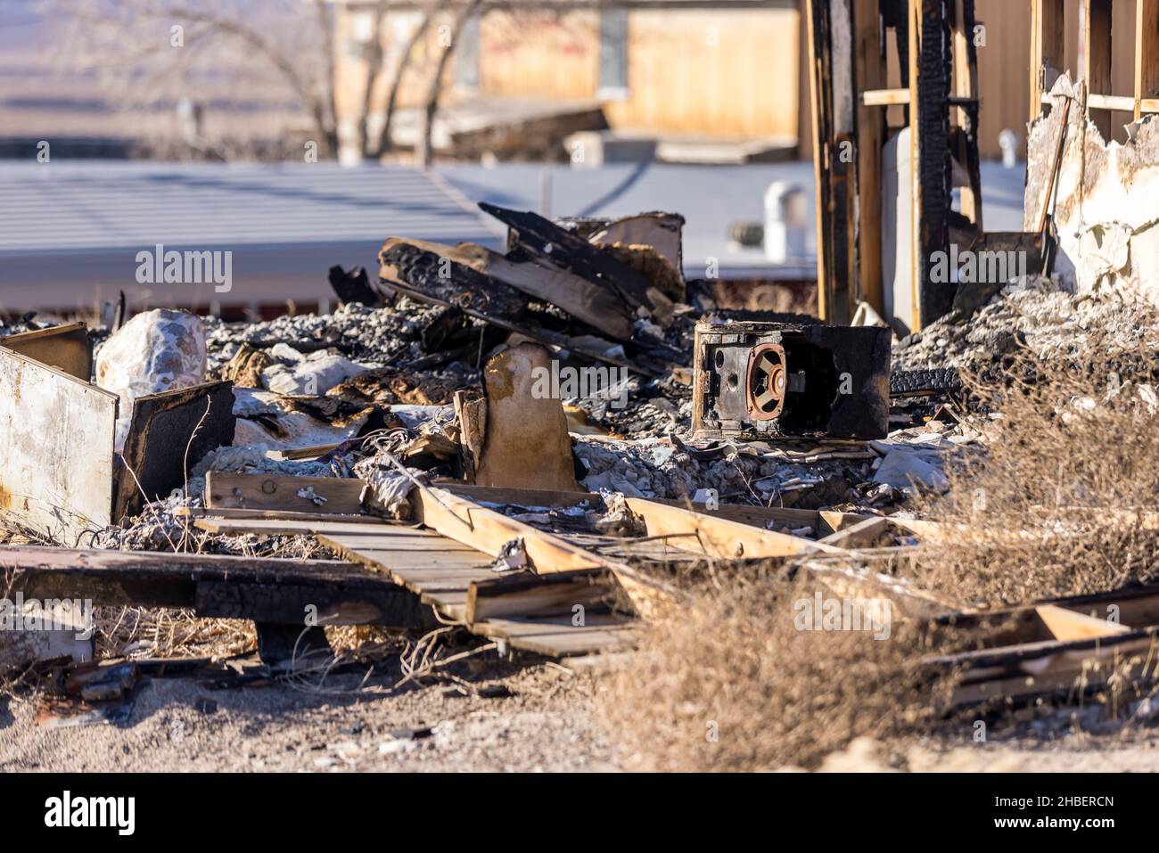 Burned items scattered on the ground left over from a house fire Stock ...