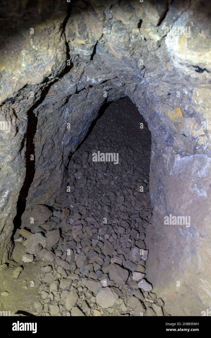 Fallen down rubble fills the shaft of an old mine tunnel Stock Photo ...