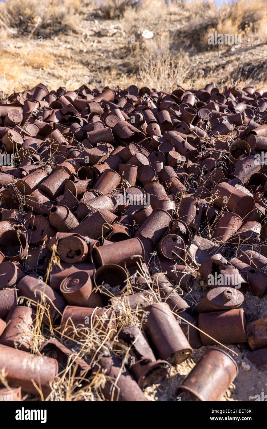 Canyon filled with rusty pile of old food and oil cans from a mining ...