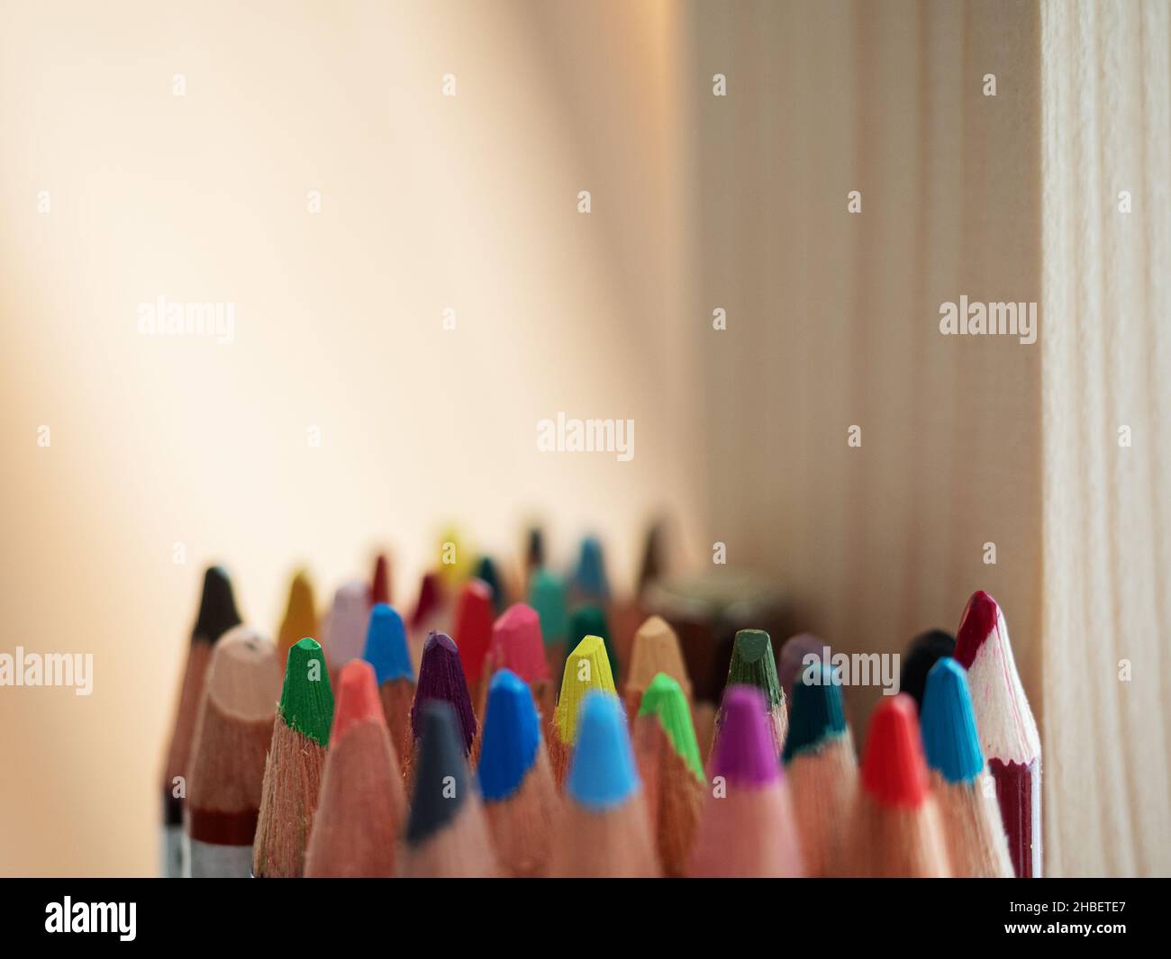 A large group of colored pencils on light background Stock Photo - Alamy