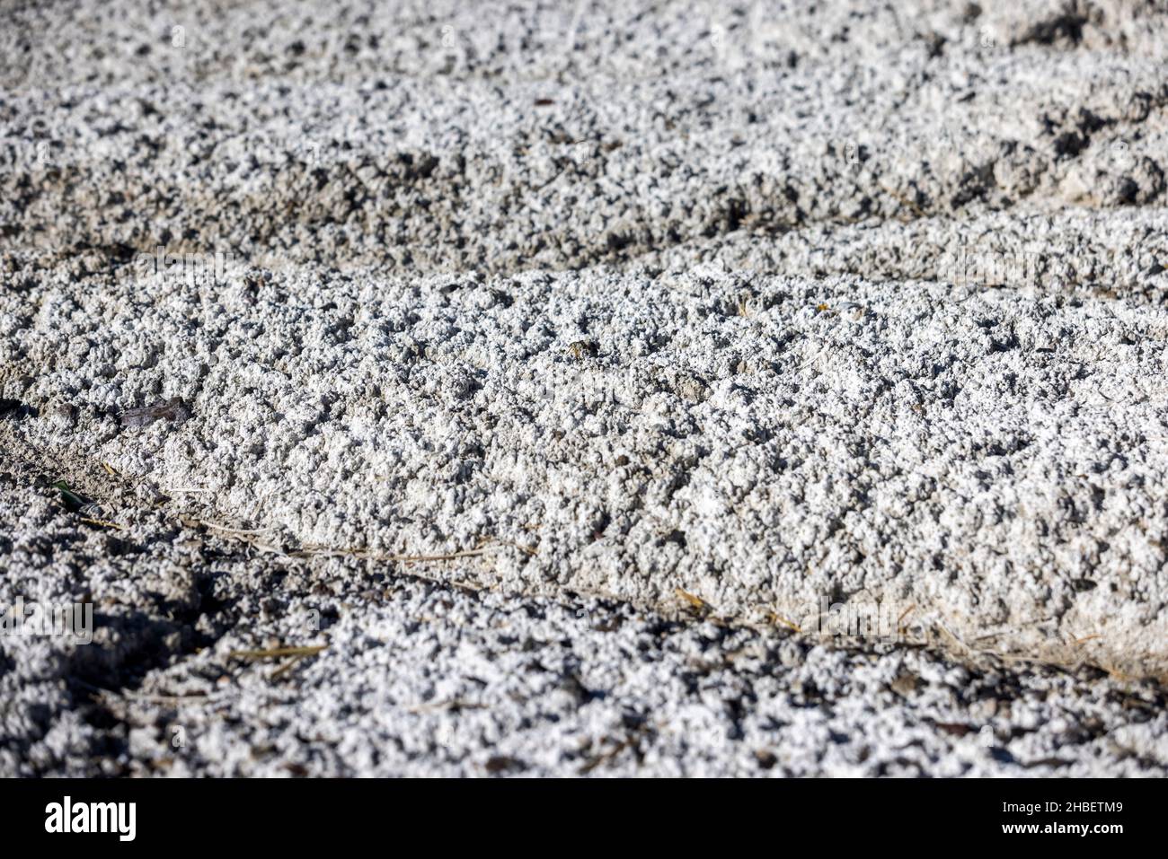 Salt flats texture close up view with water channels running through it ...