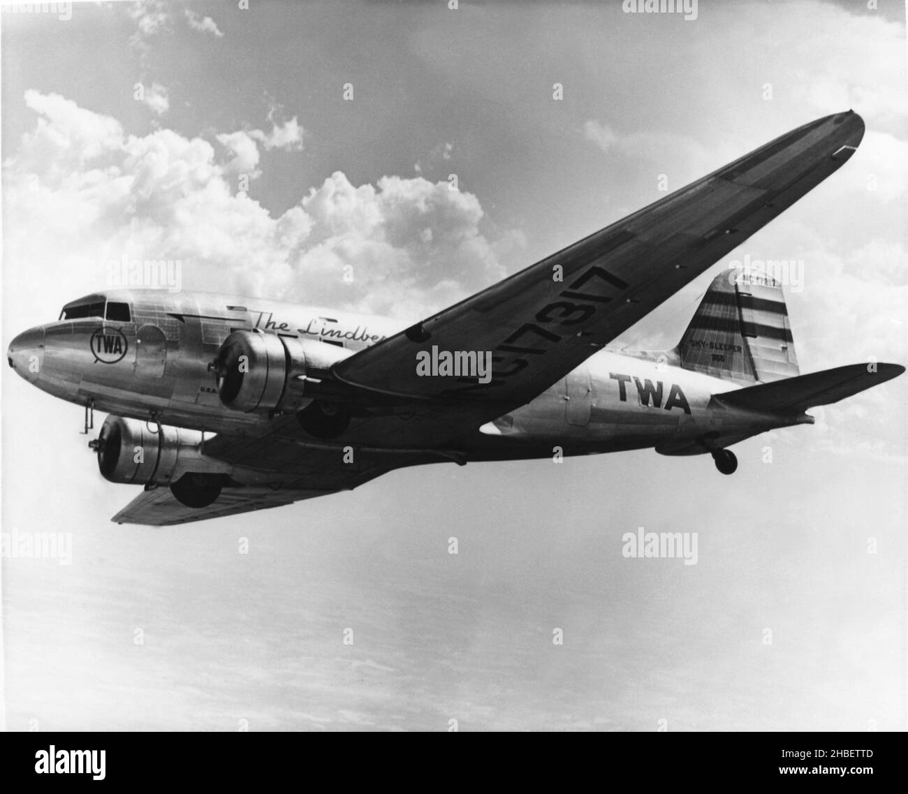 TWA - The Lindberg Line twin prop aircraft in flight Stock Photo - Alamy