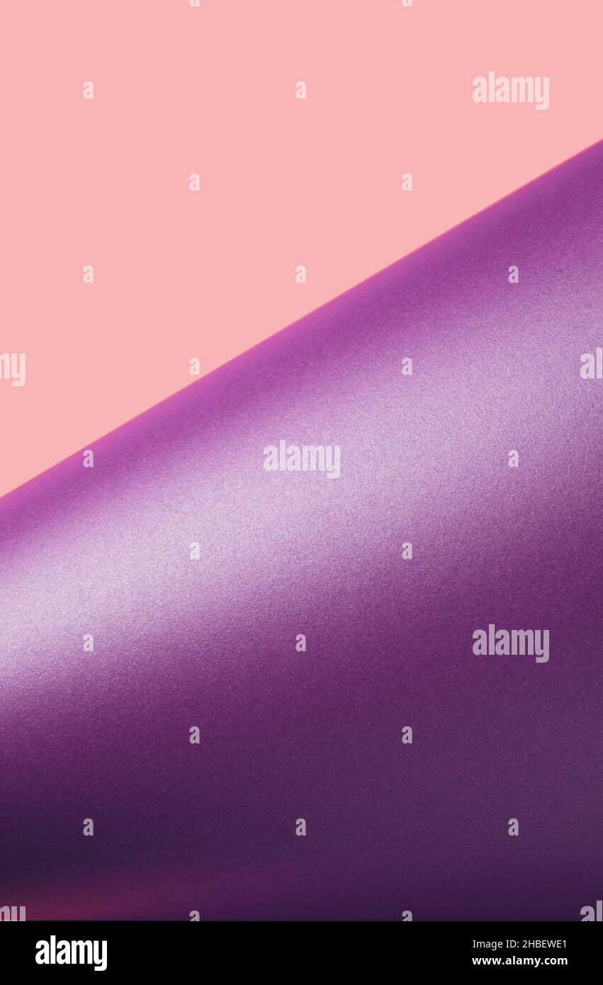 Lavender colored paper turned to expose pastel pink surface bellow ...