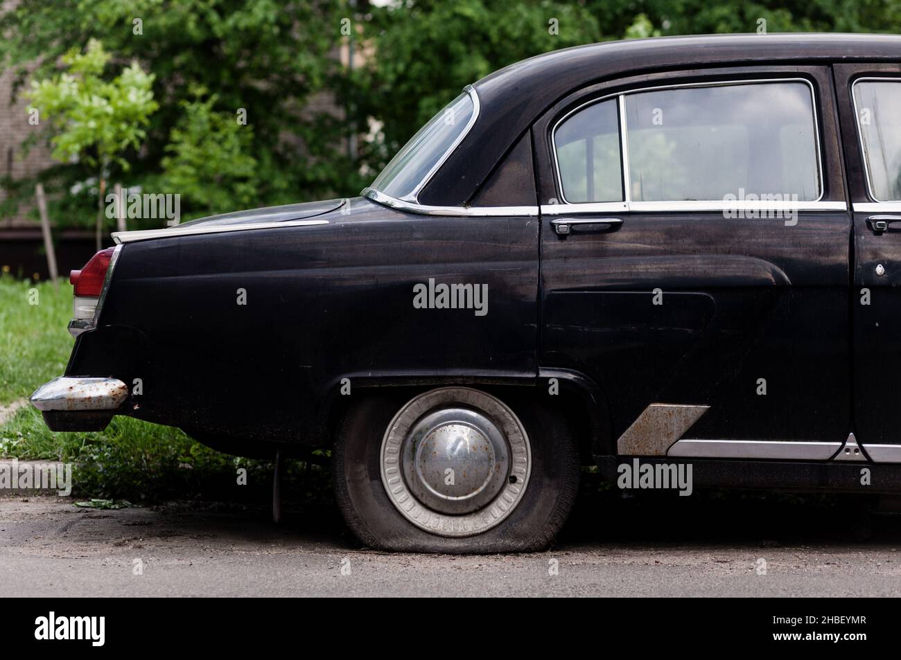 Old black automobile. Vintage transport. Nostalgia Stock Photo - Alamy
