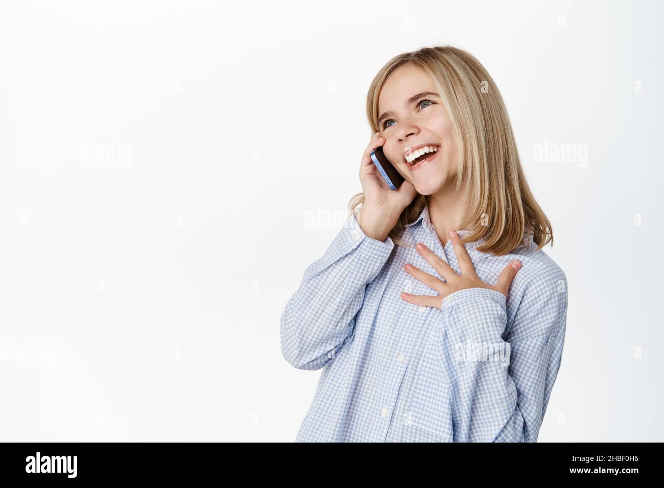 Cute little girl, beautiful blond kid talking on mobile phone, having ...