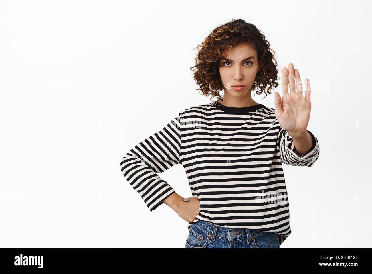 Stop. Serious and concerned young woman disapprove, prohibit action ...