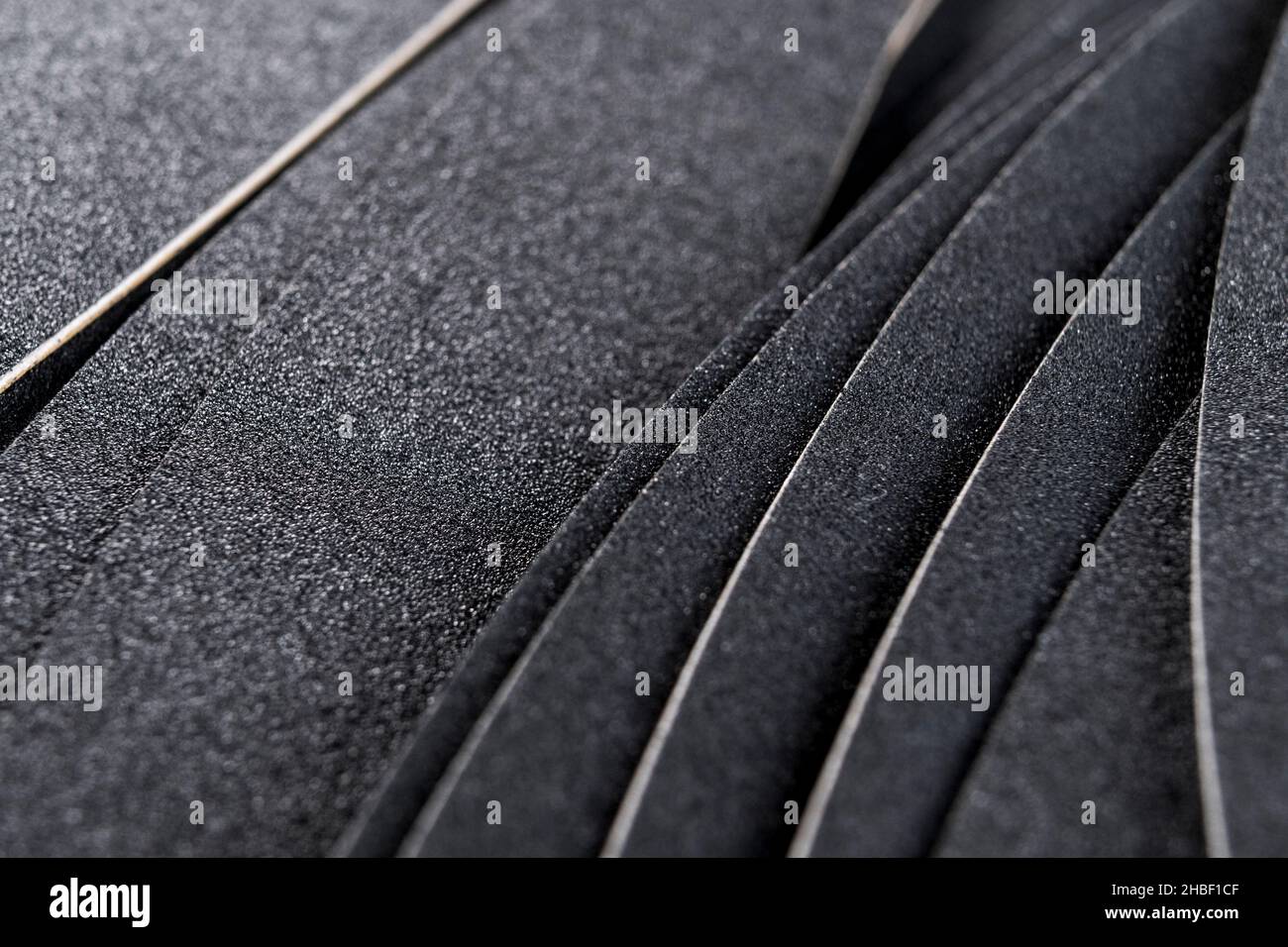 Black rough textured surface of nail files. Sandpaper strip. Pedicure ...