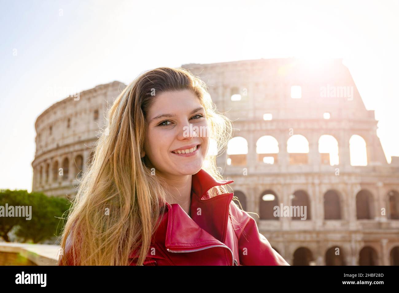 Young woman traveling to Rome. Backlight portrait of a young blonde ...