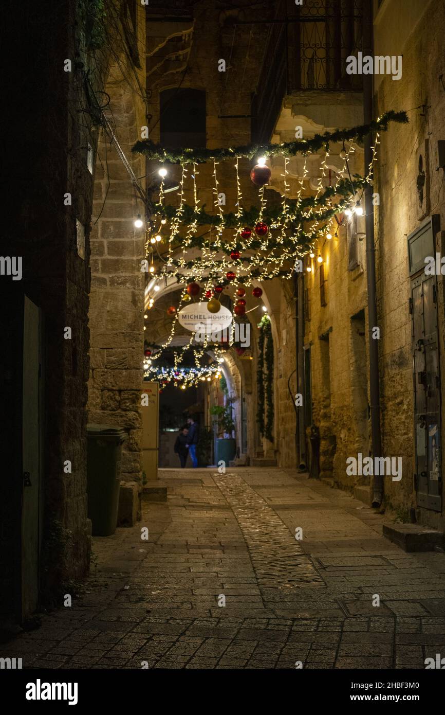 light decorations and christmas trees during new year celebration in ...
