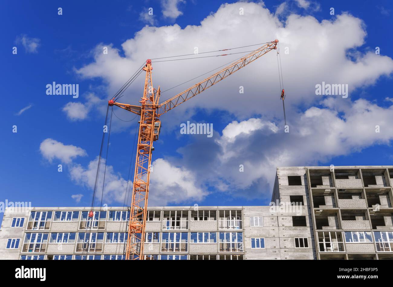 Building of houses and big cranes Stock Photo - Alamy