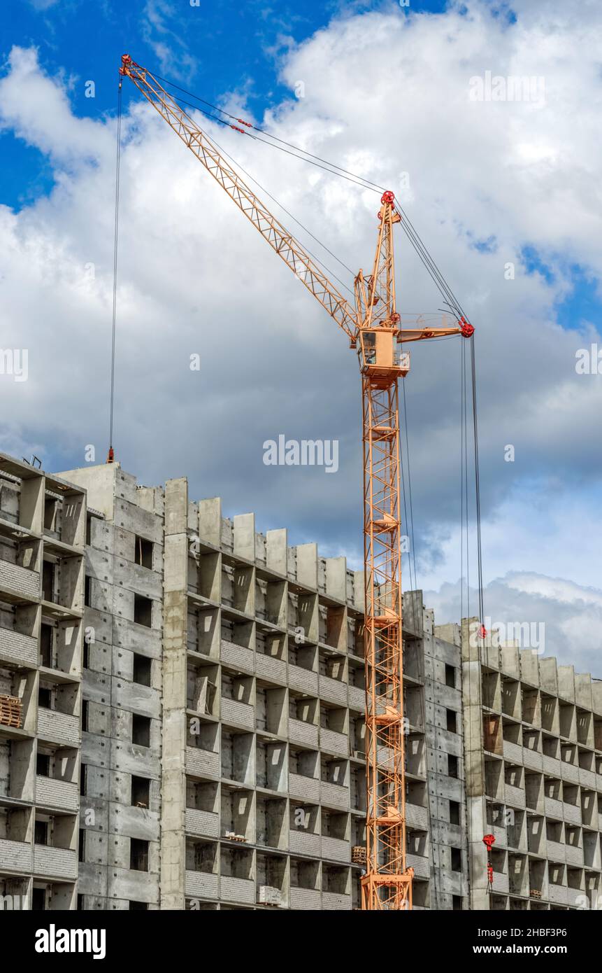 Construction works and high-rise crane Stock Photo - Alamy