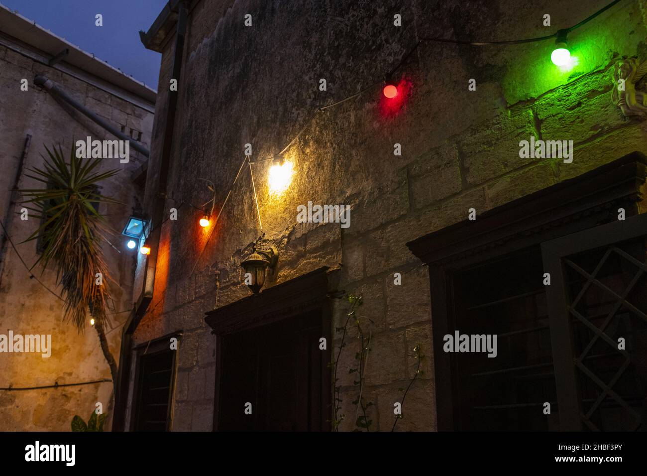 light decorations and christmas trees during new year celebration in ...