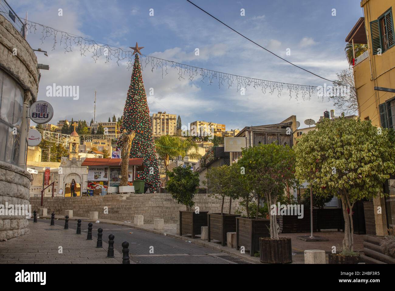 light decorations and christmas trees during new year celebration in ...