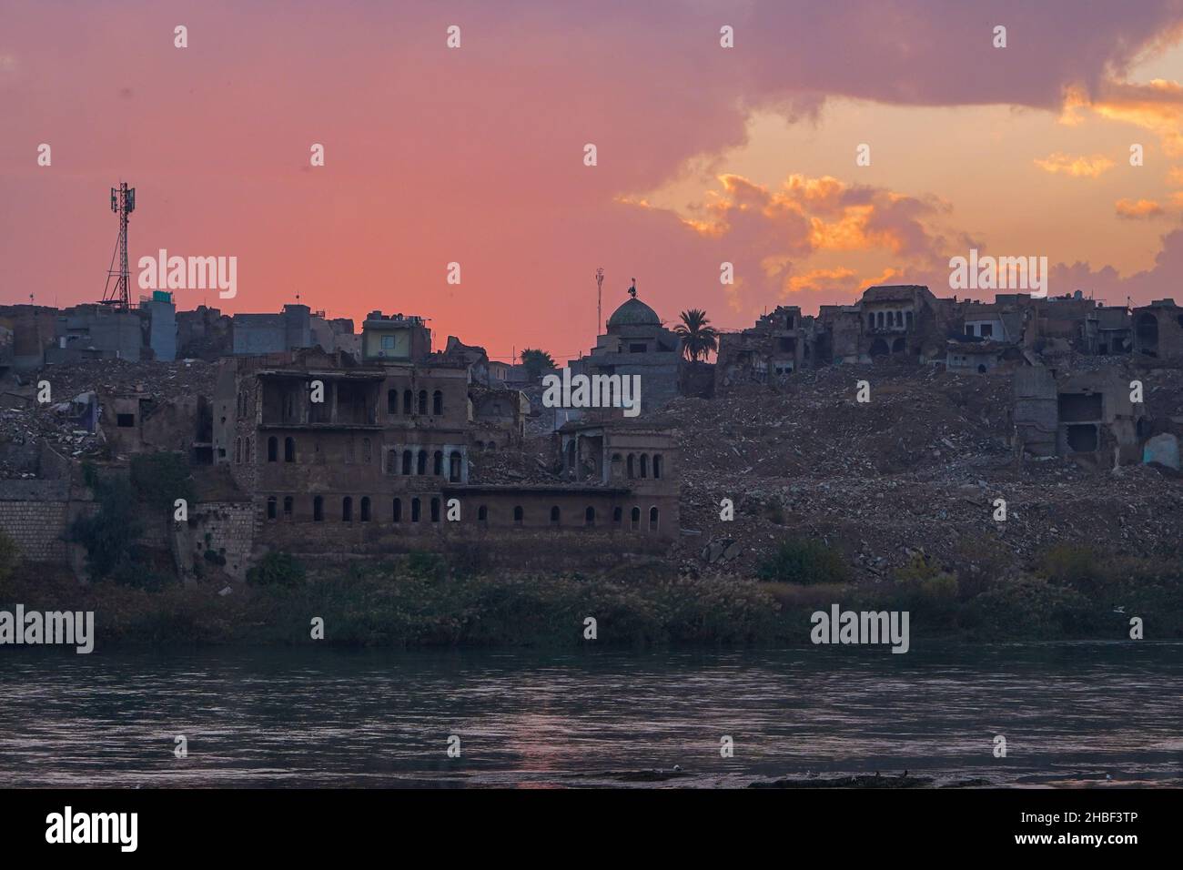 Sunset behind the old area along Tigris River in the northern Iraqi ...