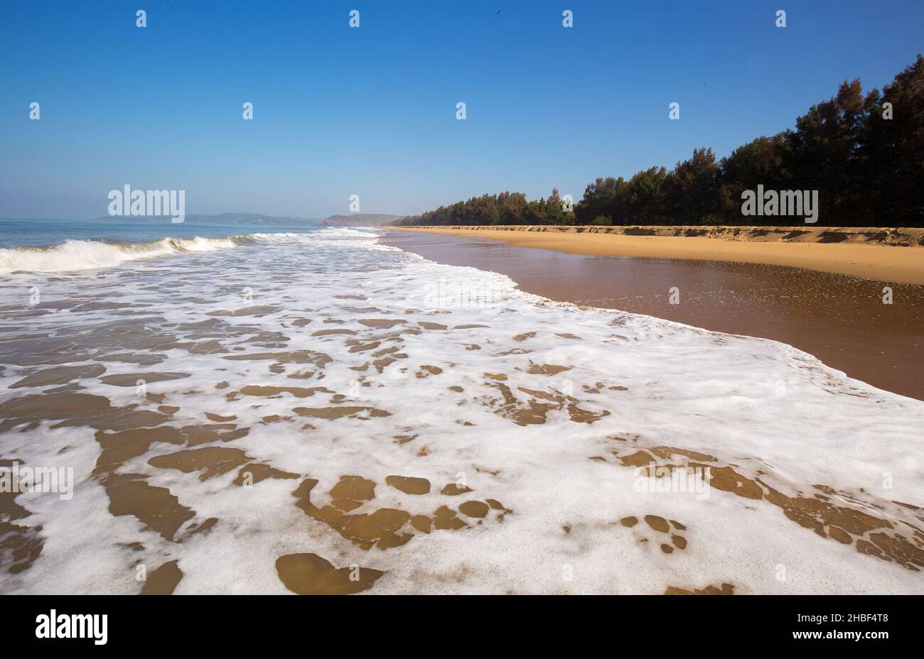 Nirvana Beach in the Kumta region of Karnataka with wave foam and sand ...
