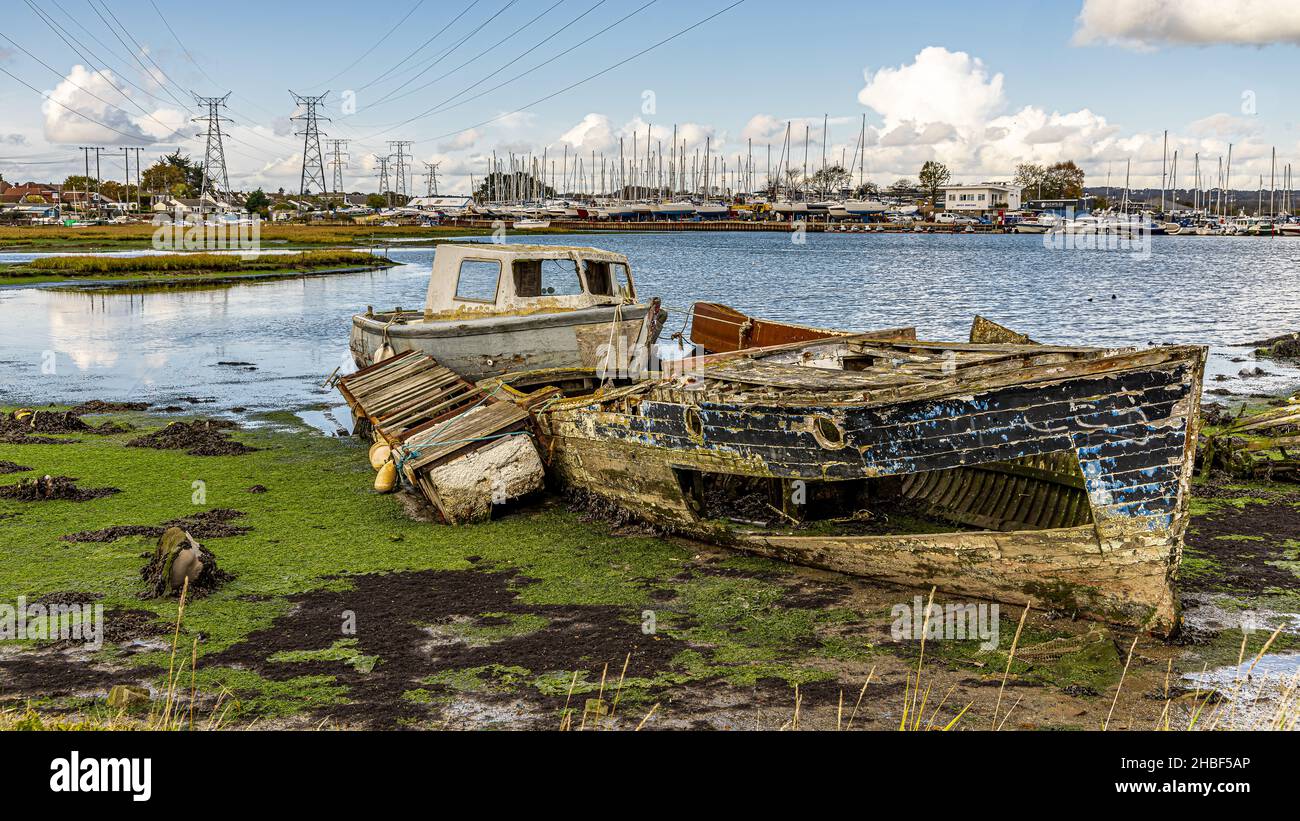 A view of a wrecked boat in the dirty water Stock Photo - Alamy