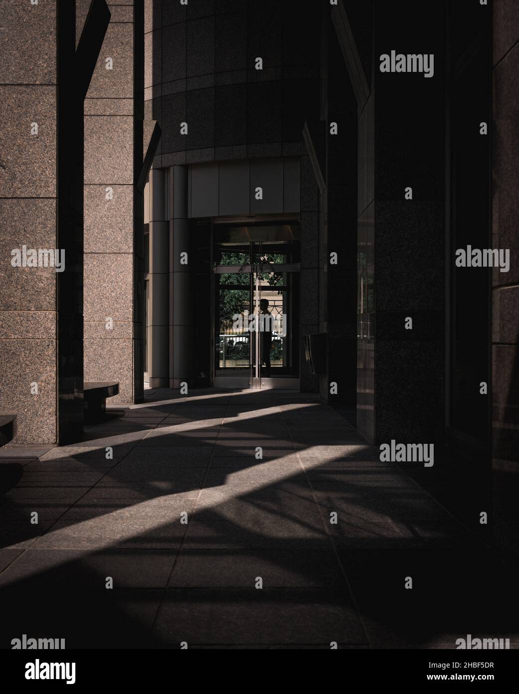 A glass entrance door to a modern building Stock Photo - Alamy