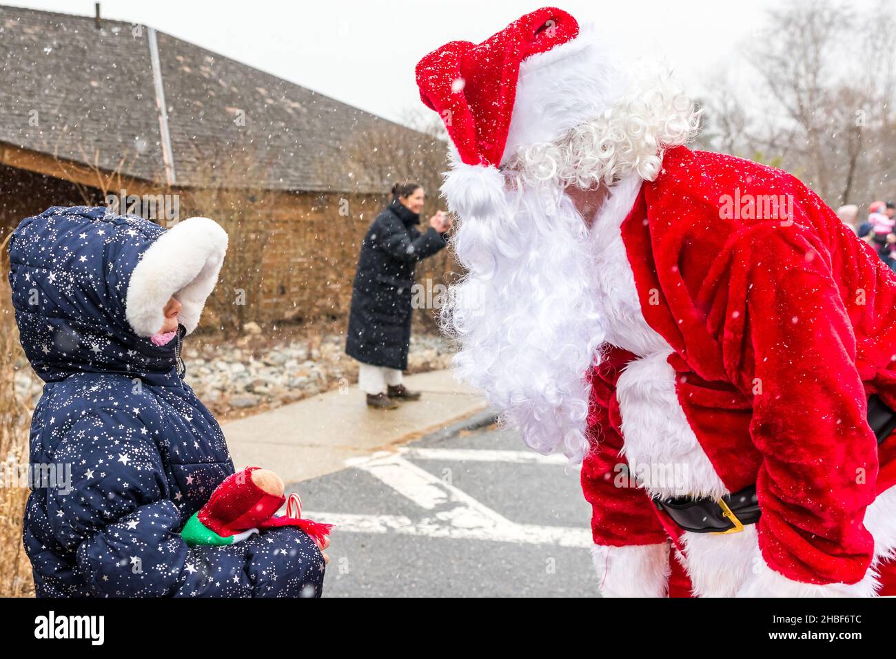 A young child telling Santa what they want for Christmas Stock Photo ...