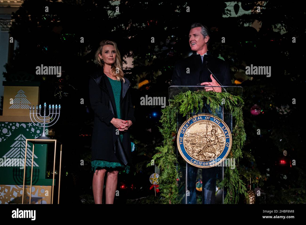 Governor Gavin Newsom speaks with his wife Jennifer Siebel Newsom at ...