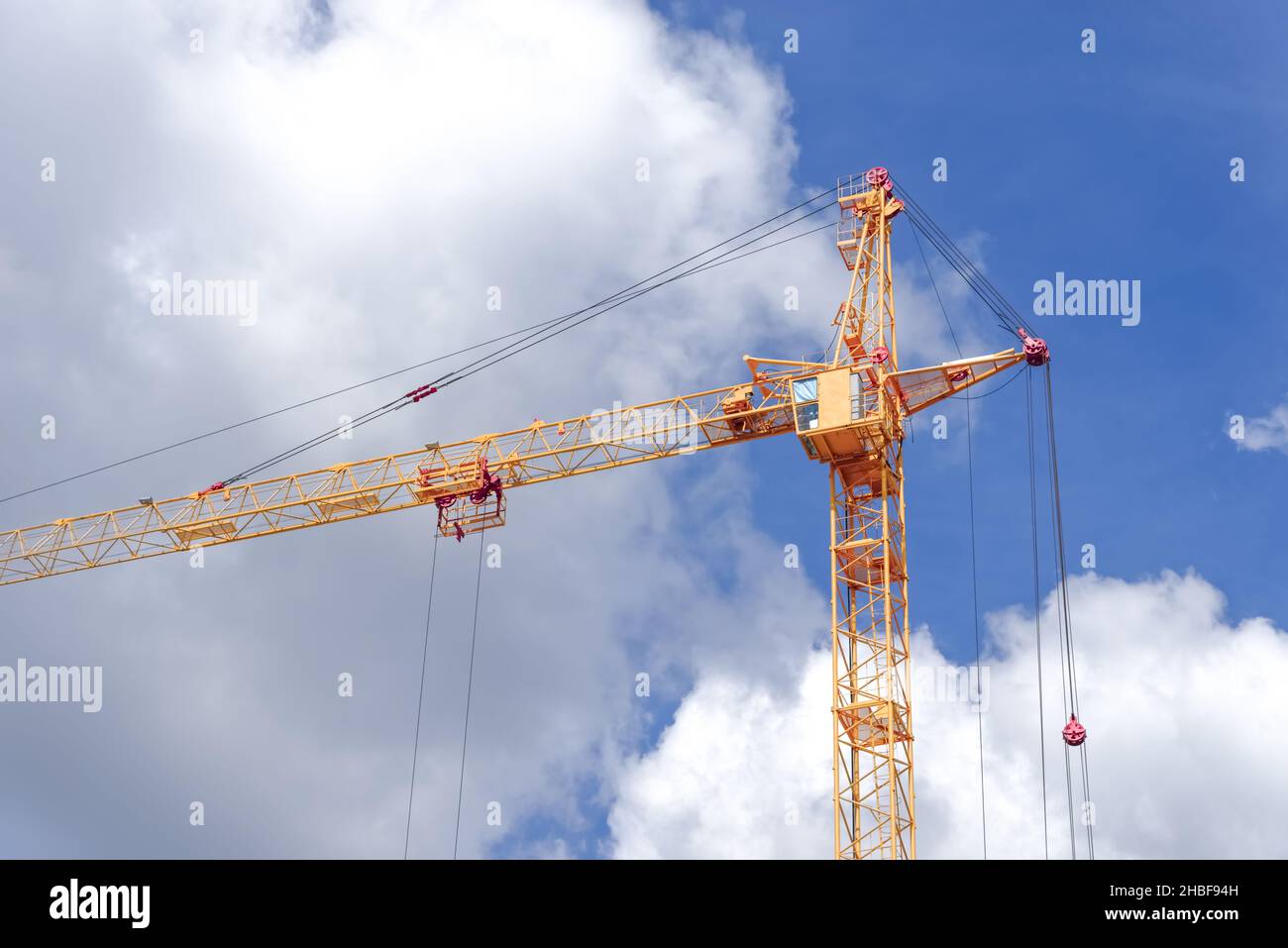 Hoisting tower cranes Stock Photo - Alamy
