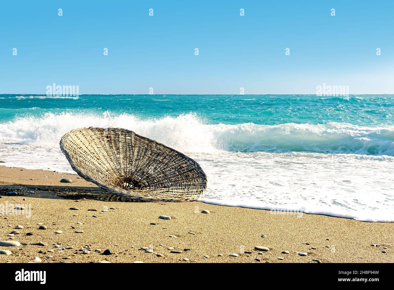 reed beach parasol in the surf, blown away by the wind during a storm ...