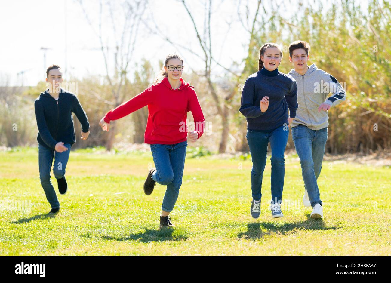 Group cheerful students running in hi-res stock photography and images ...
