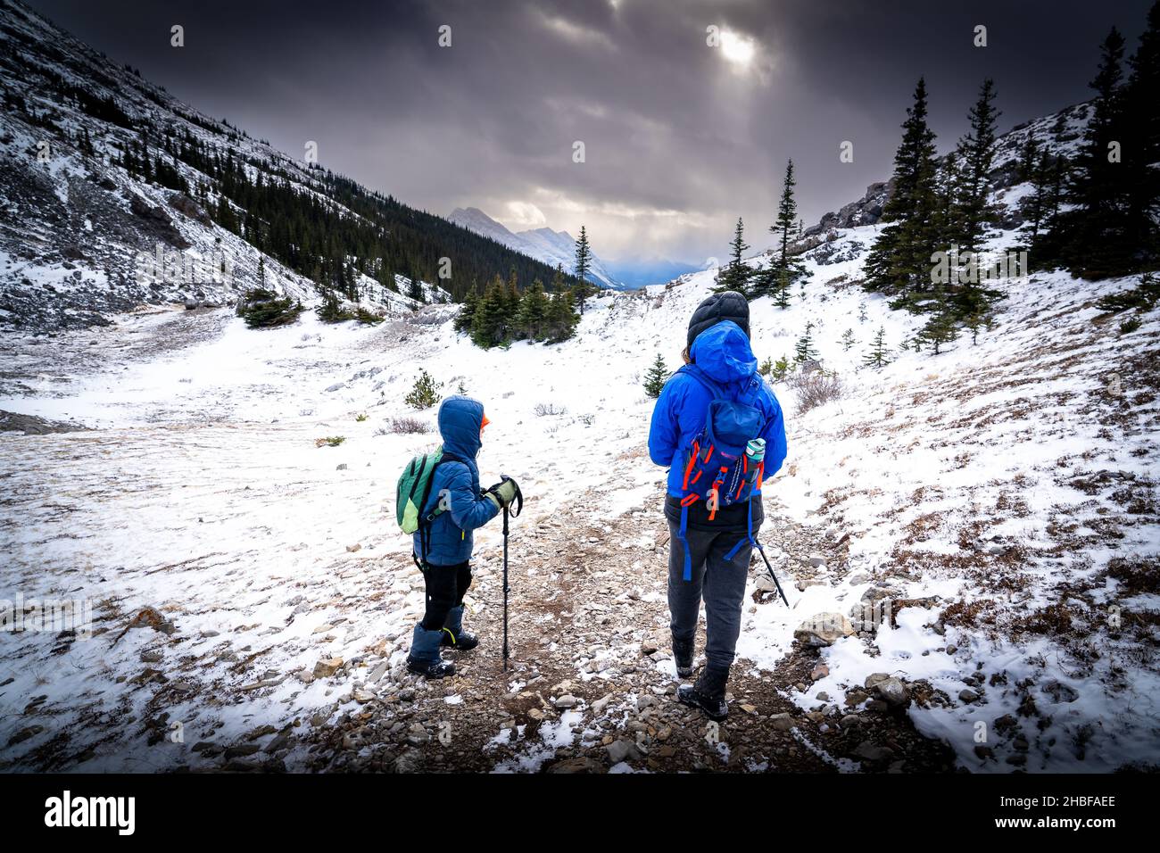 Canmore Alberta Canada, November 24 2021: A brother a sister hiking a ...