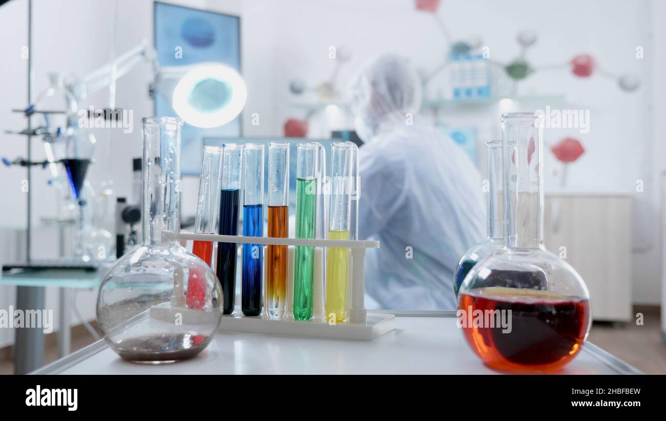 Microbiologist researcher doctor using medical transparent glassware ...