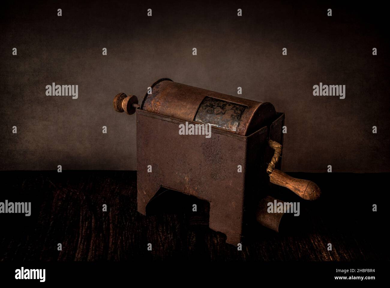 Still life with rustic rusty coffee roaster on vintage grunge ...