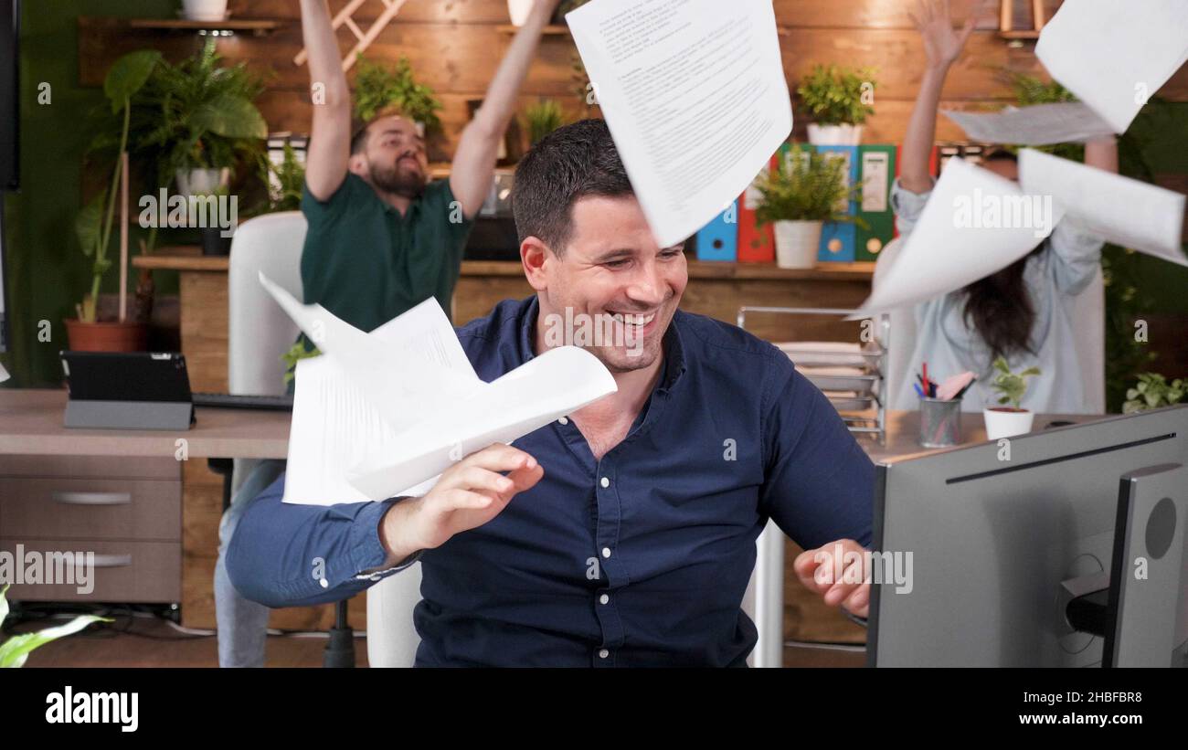 Happy manager throwing papers finishing hi-res stock photography and ...