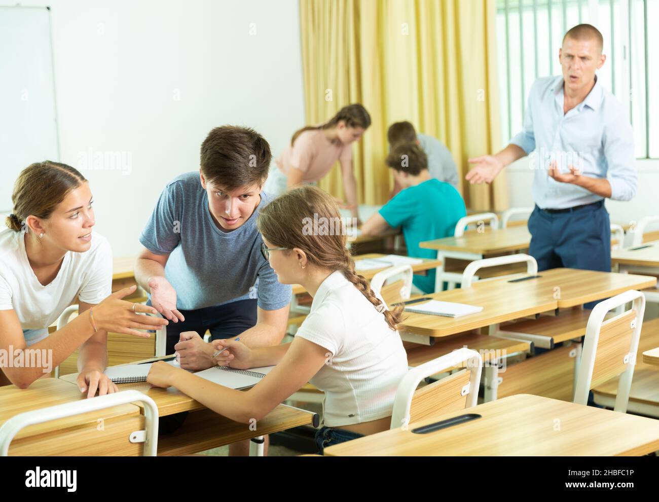 Pupils sitting in class by groups Stock Photo - Alamy
