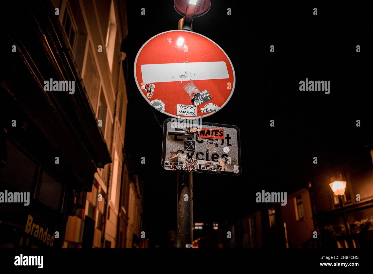 An old stop sign hung on a metallic pipe in the nighttime Stock Photo ...