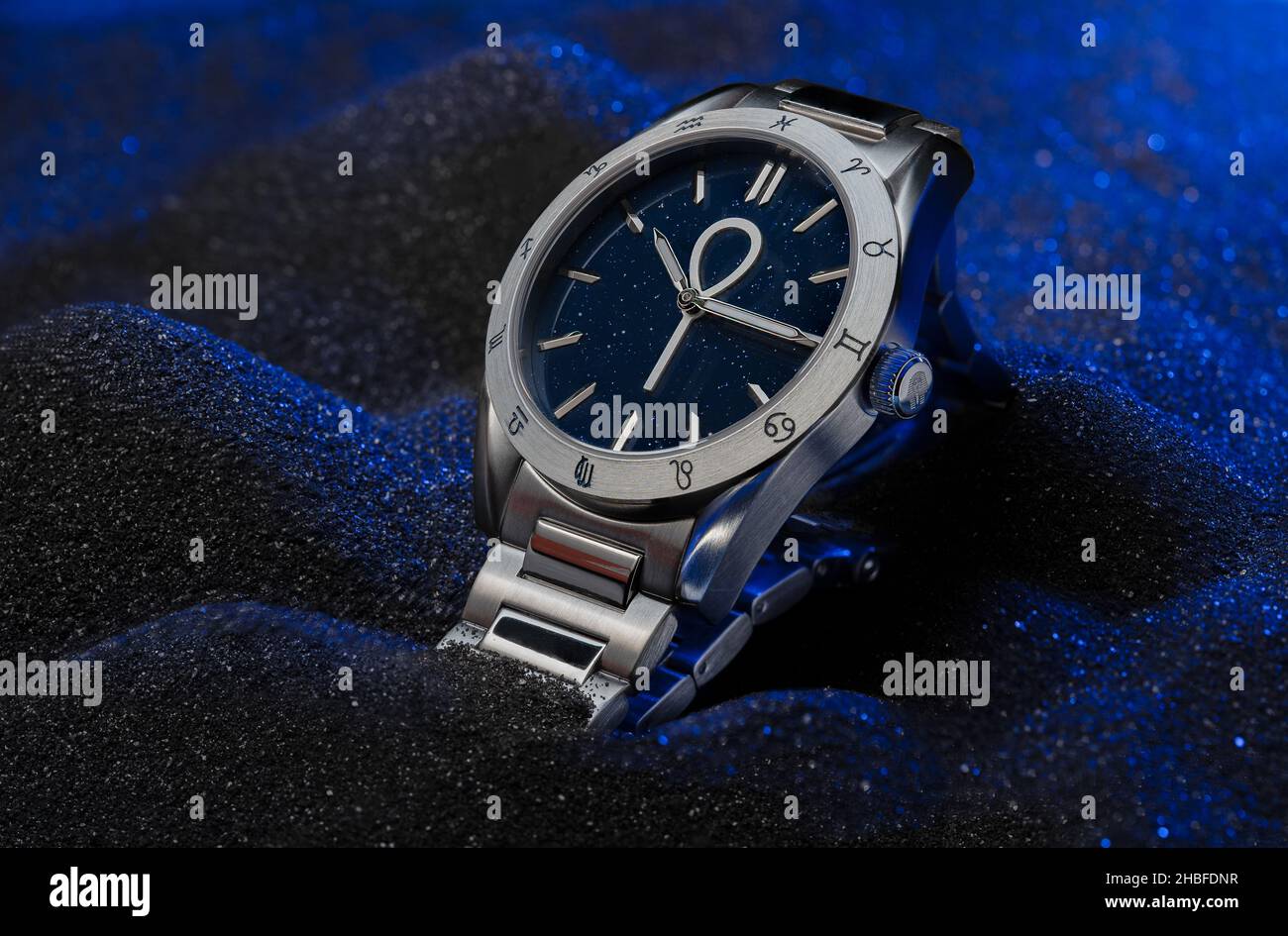 An Ankh themed watch on black sand Stock Photo - Alamy