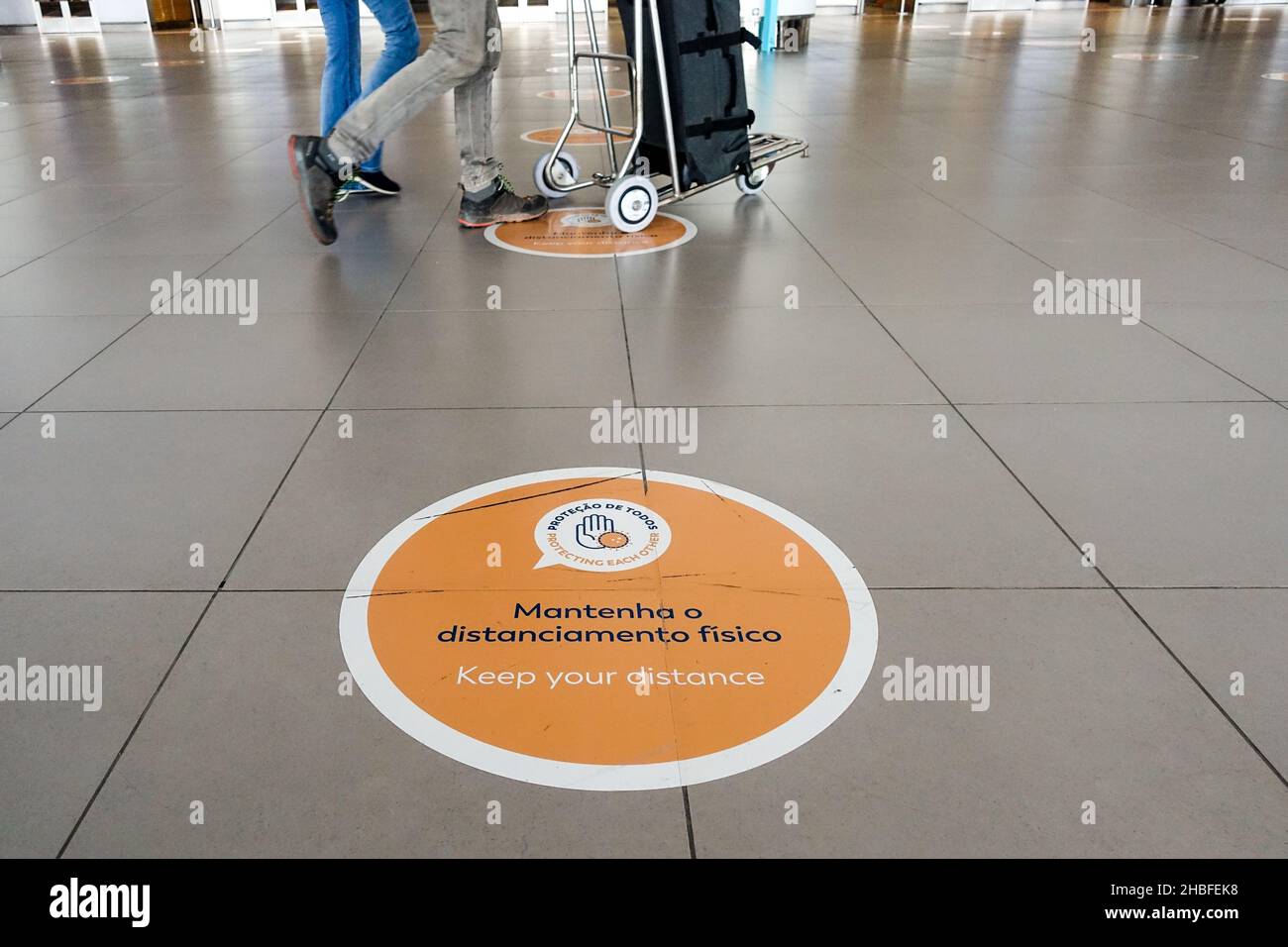 "Keep your distance" signs at Faro Airport, Portugal, as travellers ...