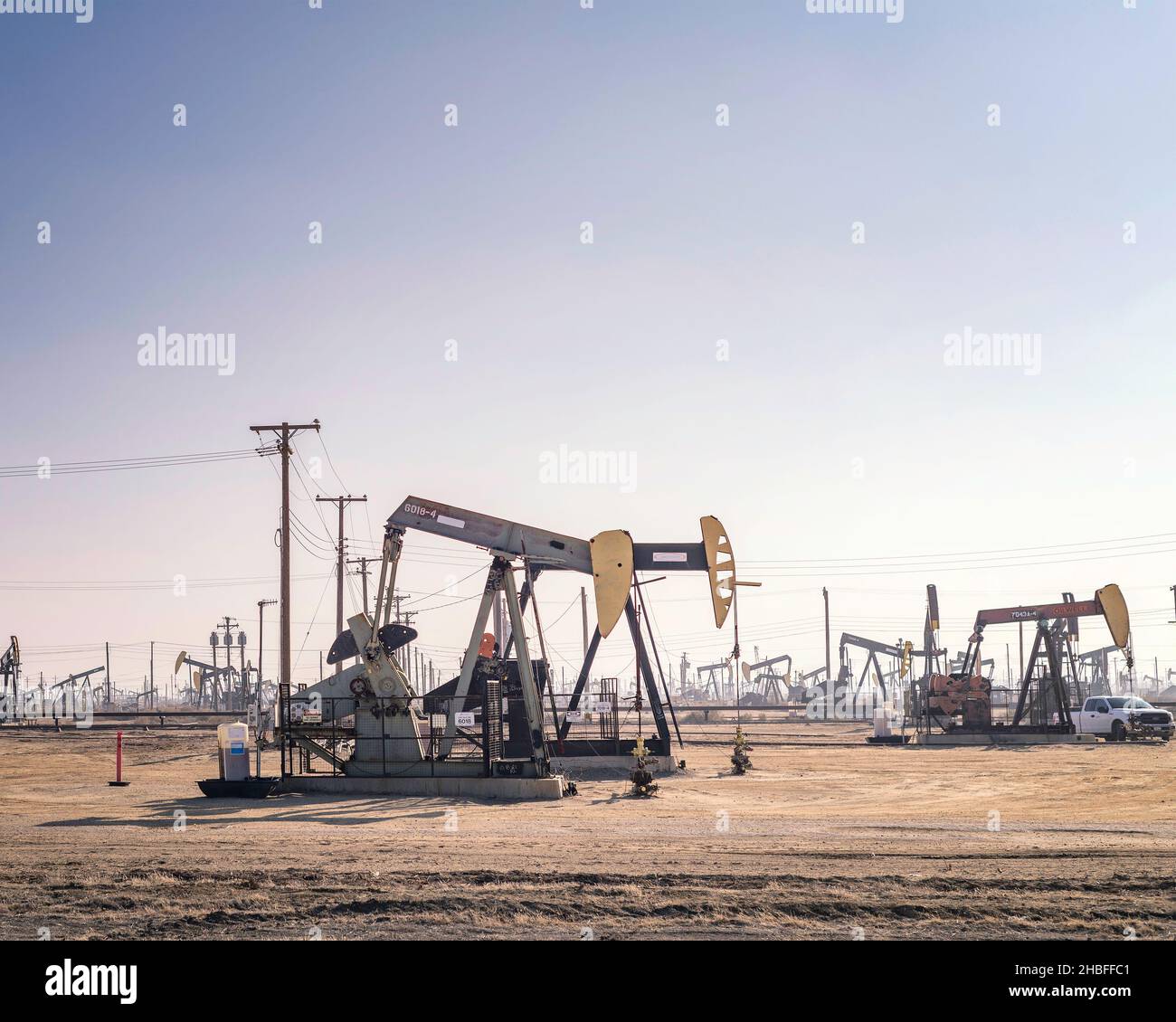 Lost Hills, CA, USA - December 8, 2021: A pumpjack operates at an oil ...