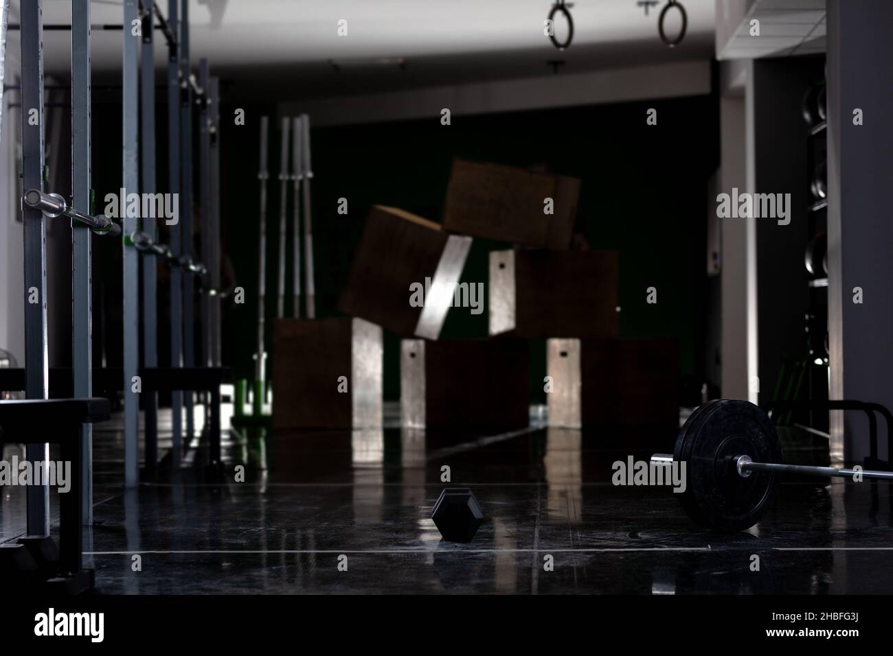 Workout interior with heavy weights, barbell, and other equipment ...