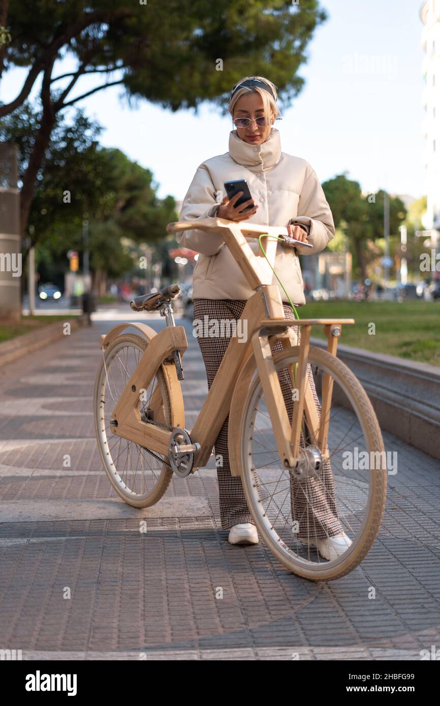 Full body woman using app on phone hi-res stock photography and images ...