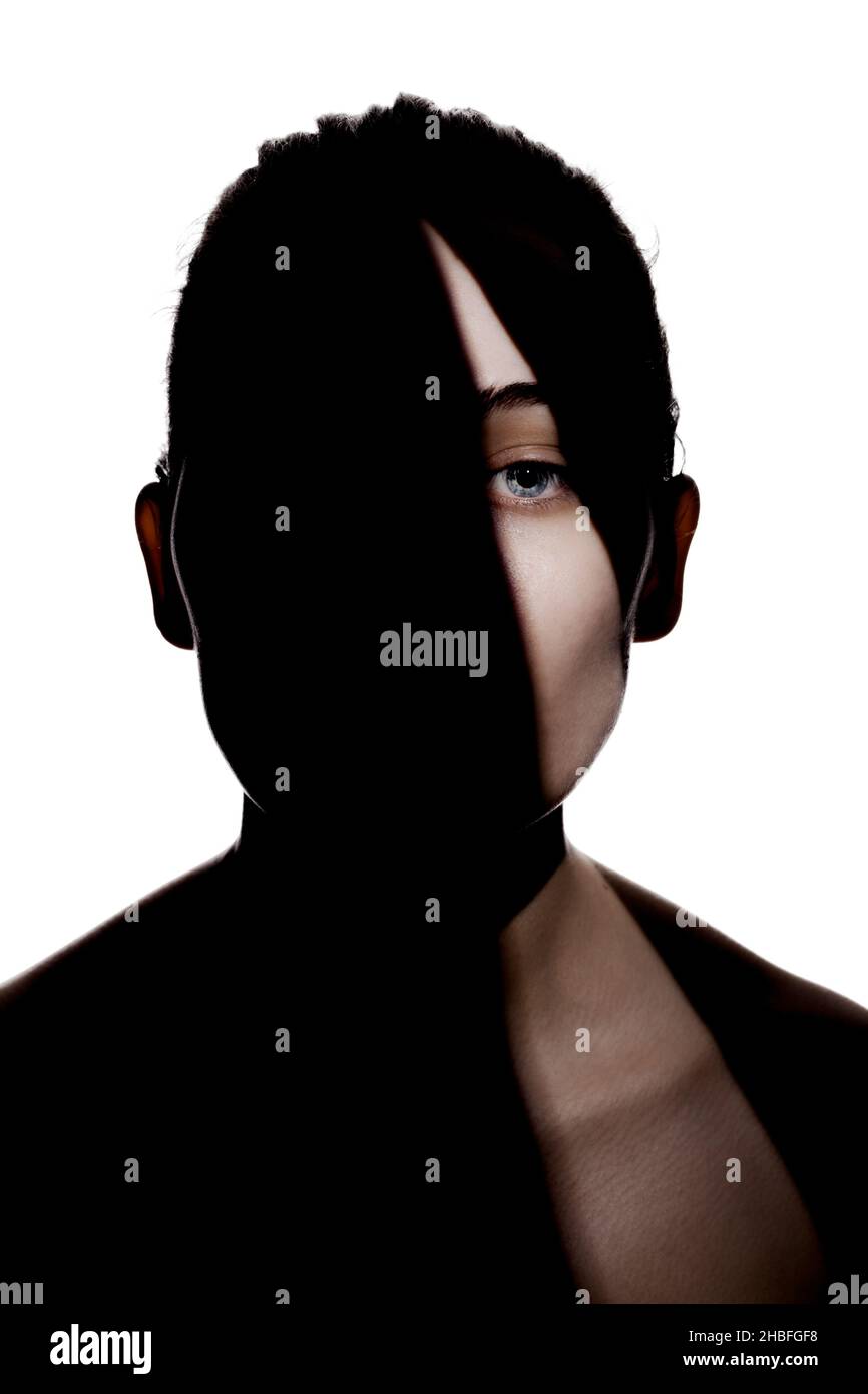 Fashionable studio portrait of a cute girl. Silhouette of a beautiful ...