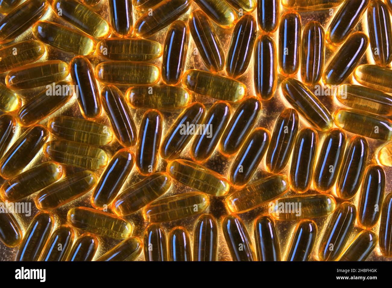 Fish oil capsules background. omega fatty acids.Natural supplements and ...