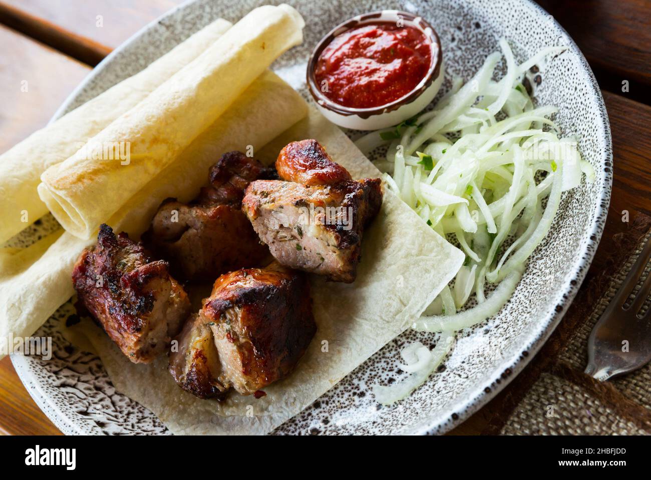 Oriental grilled pork meat shashlik Stock Photo - Alamy