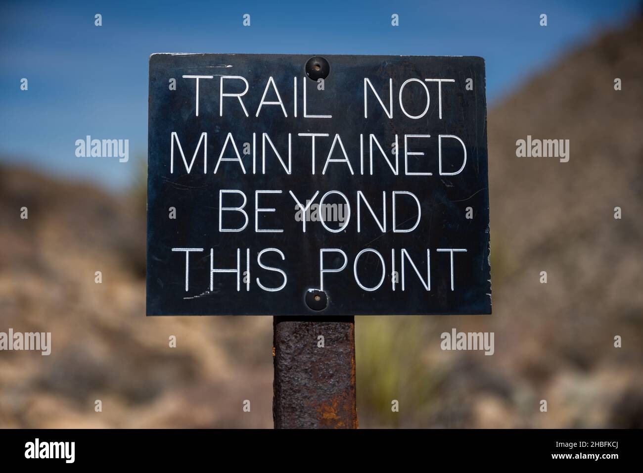 Trail Not Maintained Sign In Desert separates trail from route in ...