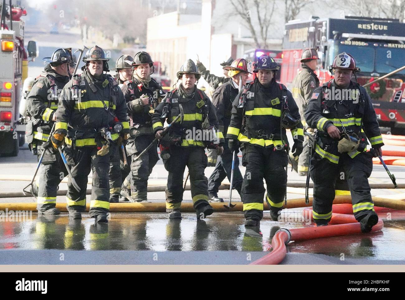 St. Louis, United States. 19th Dec, 2021. St. Louis firefighters move ...